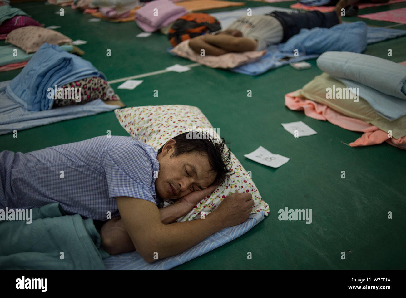 Children sleeping on floor mats hi-res stock photography and images - Alamy