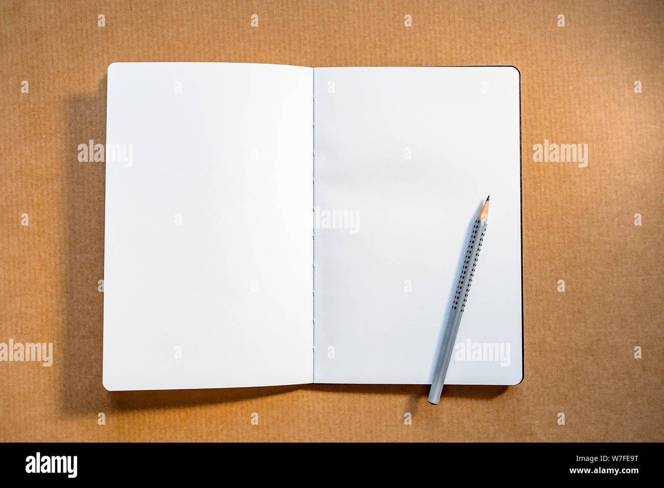 Open blank textbook pencil hi-res stock photography and images - Alamy