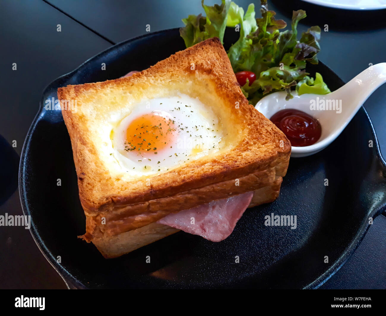 Breakfast - bread with egg and ham Stock Photo - Alamy