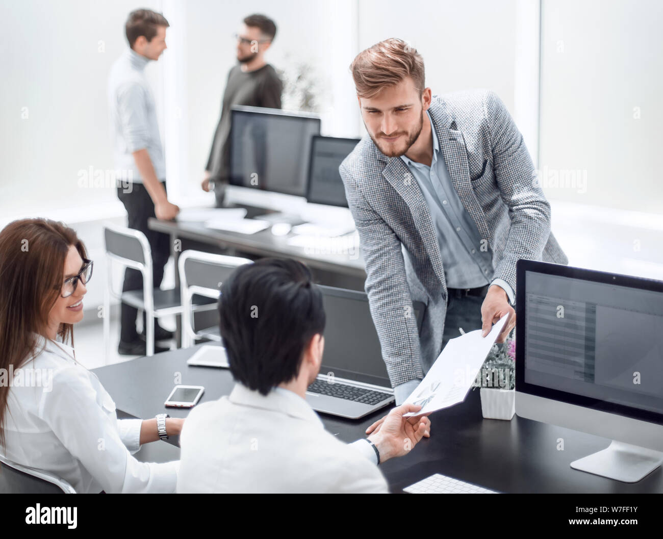 employees working with documents in the office Stock Photo - Alamy
