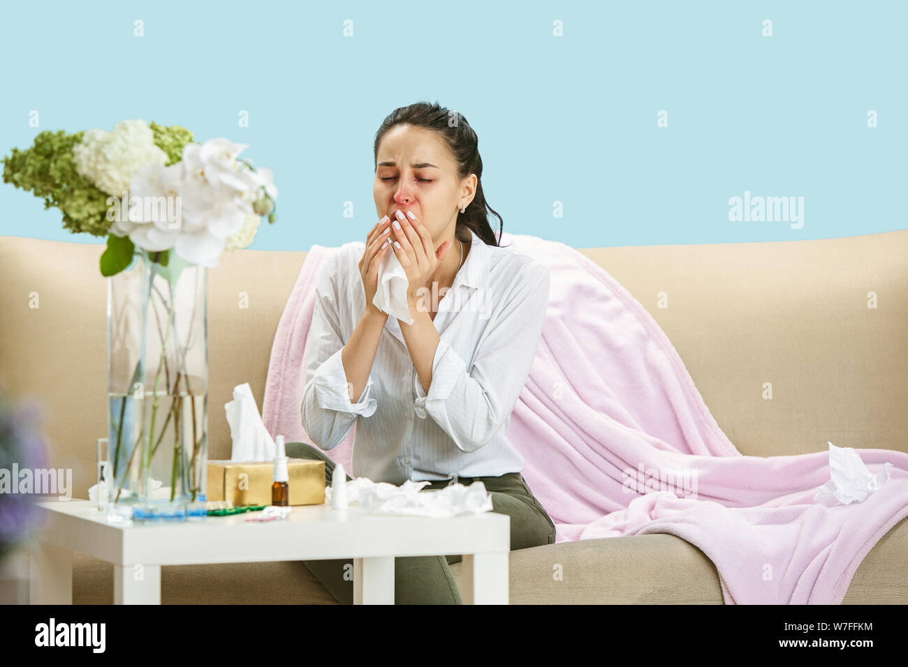 Sick woman taking napkin sneezing hi-res stock photography and images ...