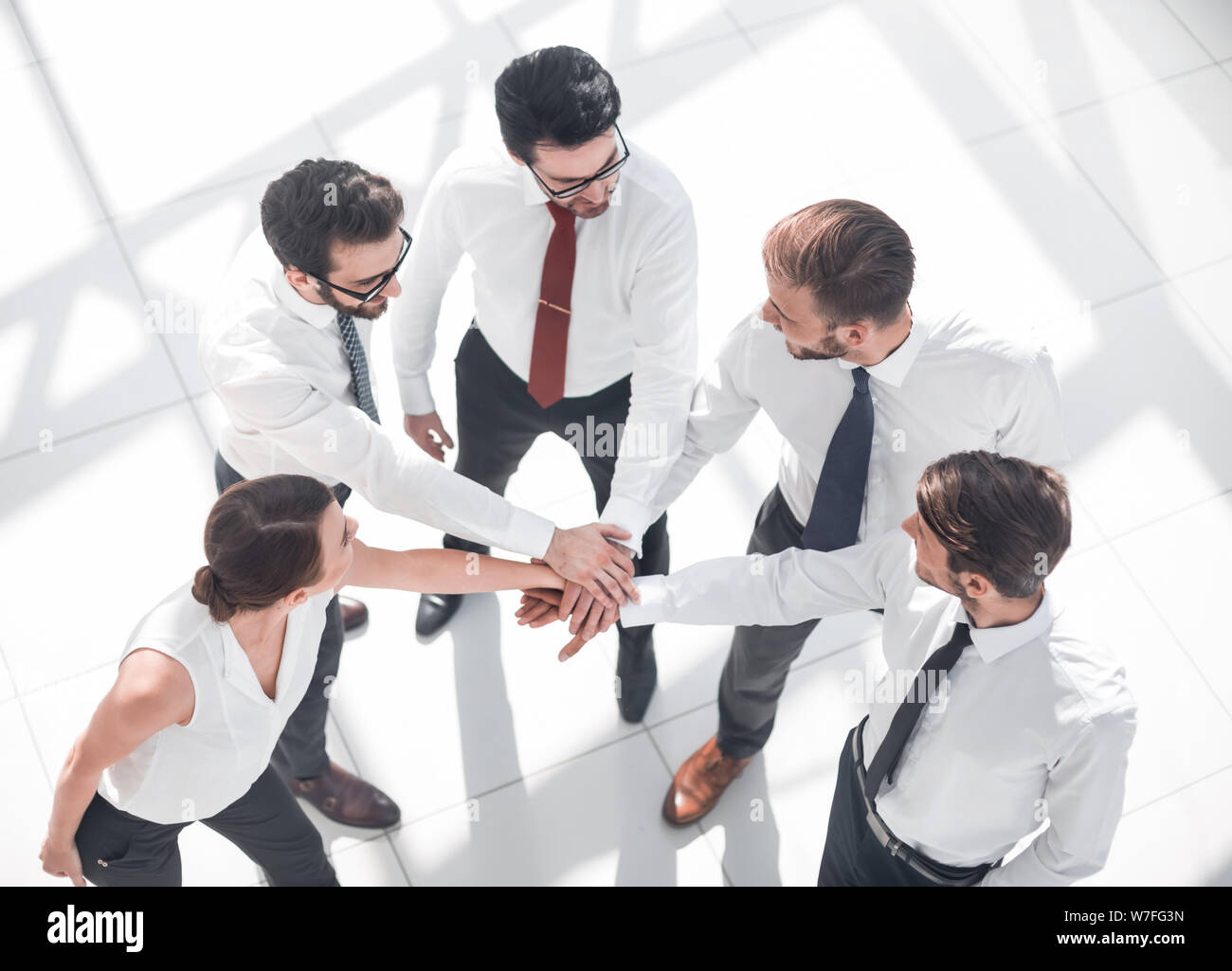 top view. young business team showing their unity Stock Photo - Alamy