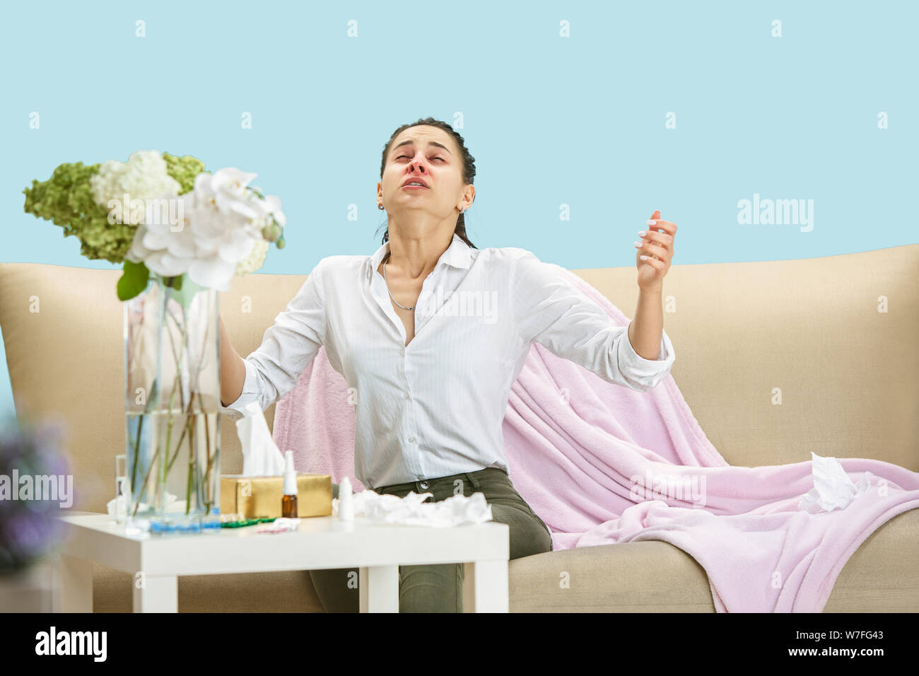 Sick woman taking napkin sneezing hi-res stock photography and images ...