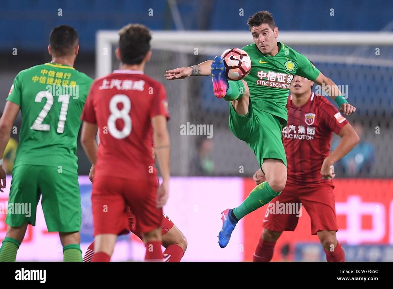 Spanish football player Jonathan Soriano, right, of Beijing Sinobo ...