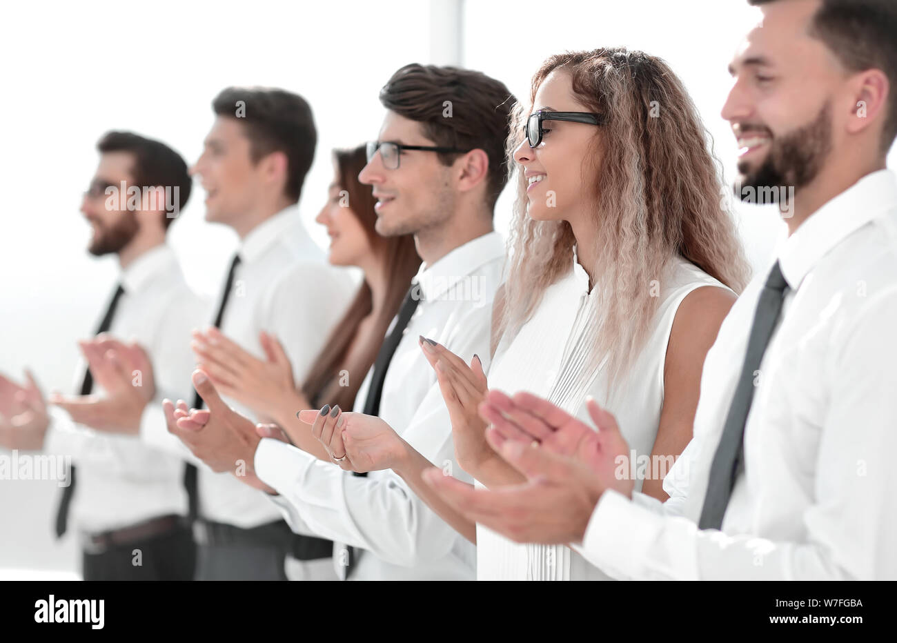 Applauding leadership smiling standing hi-res stock photography and ...