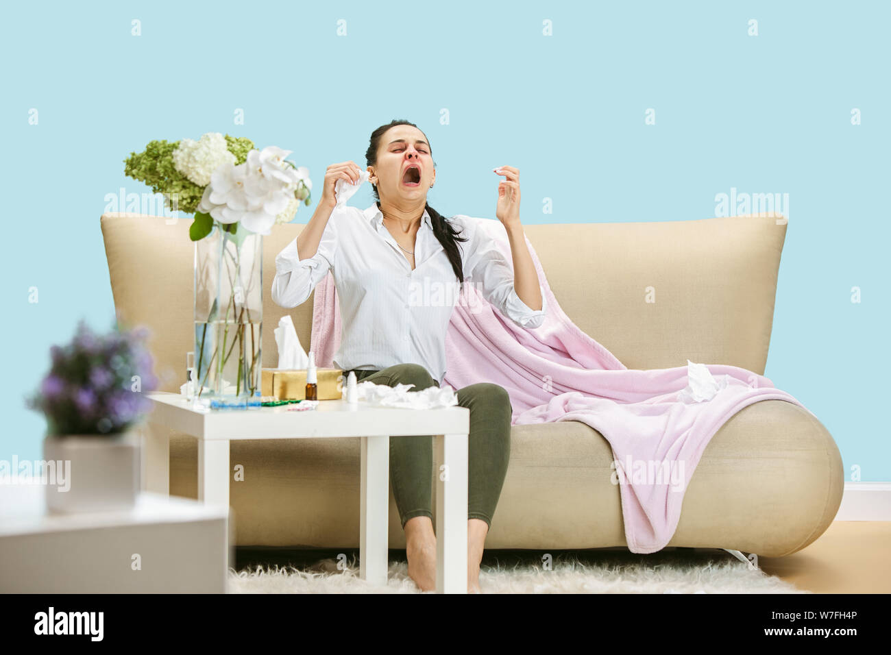 Sick woman taking napkin sneezing hi-res stock photography and images ...