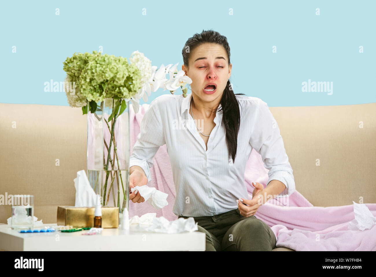 Sick woman taking napkin sneezing hi-res stock photography and images ...