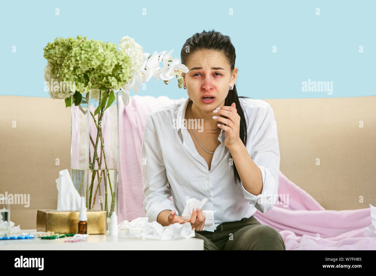 Sick woman taking napkin sneezing hi-res stock photography and images ...