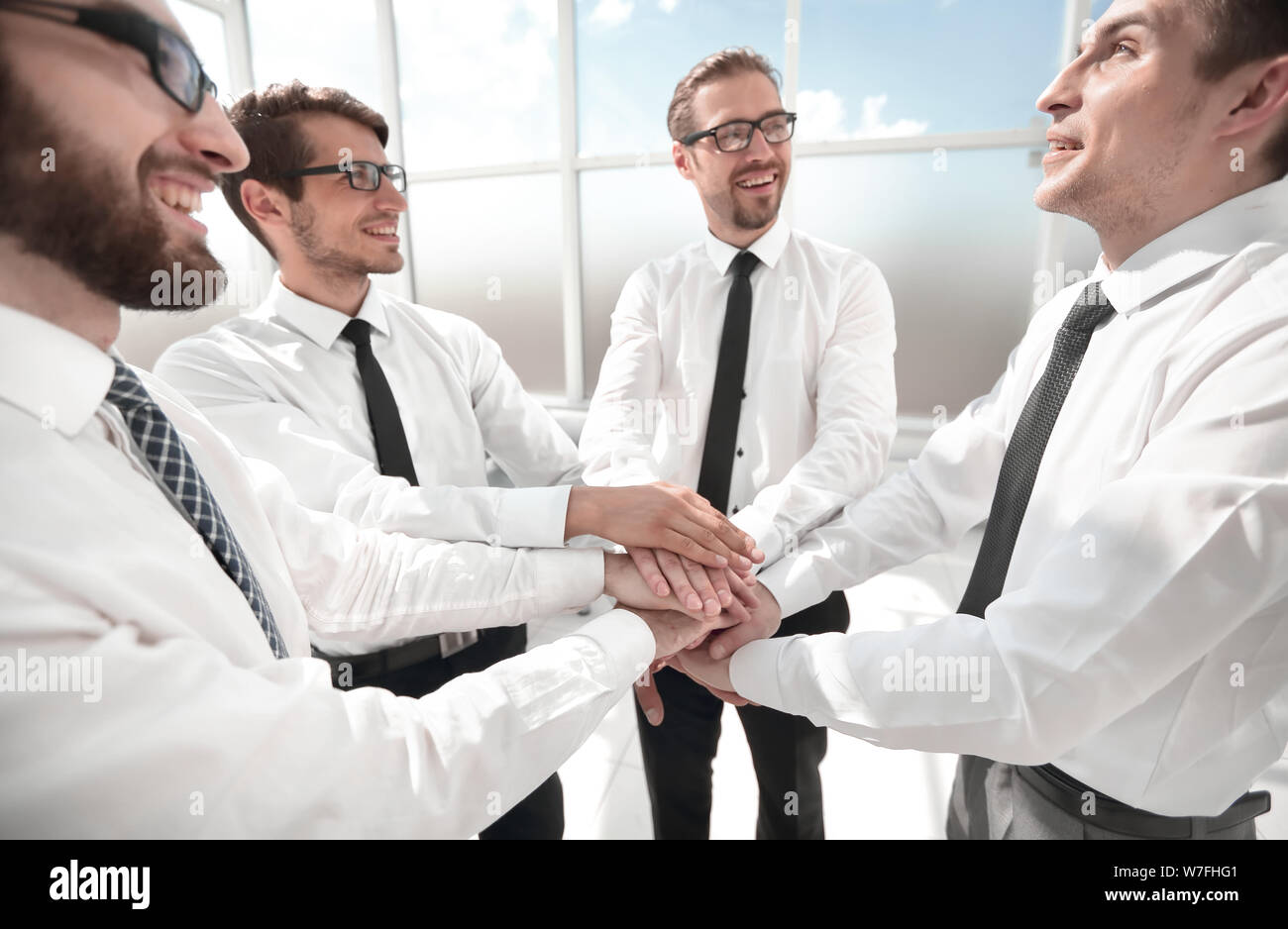successful business team put their hands together Stock Photo - Alamy