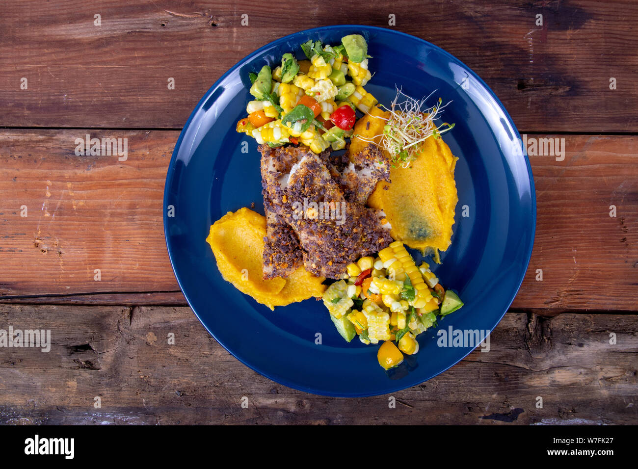 fish fillet with purple corn crust and vegetable puree with corn salad ...