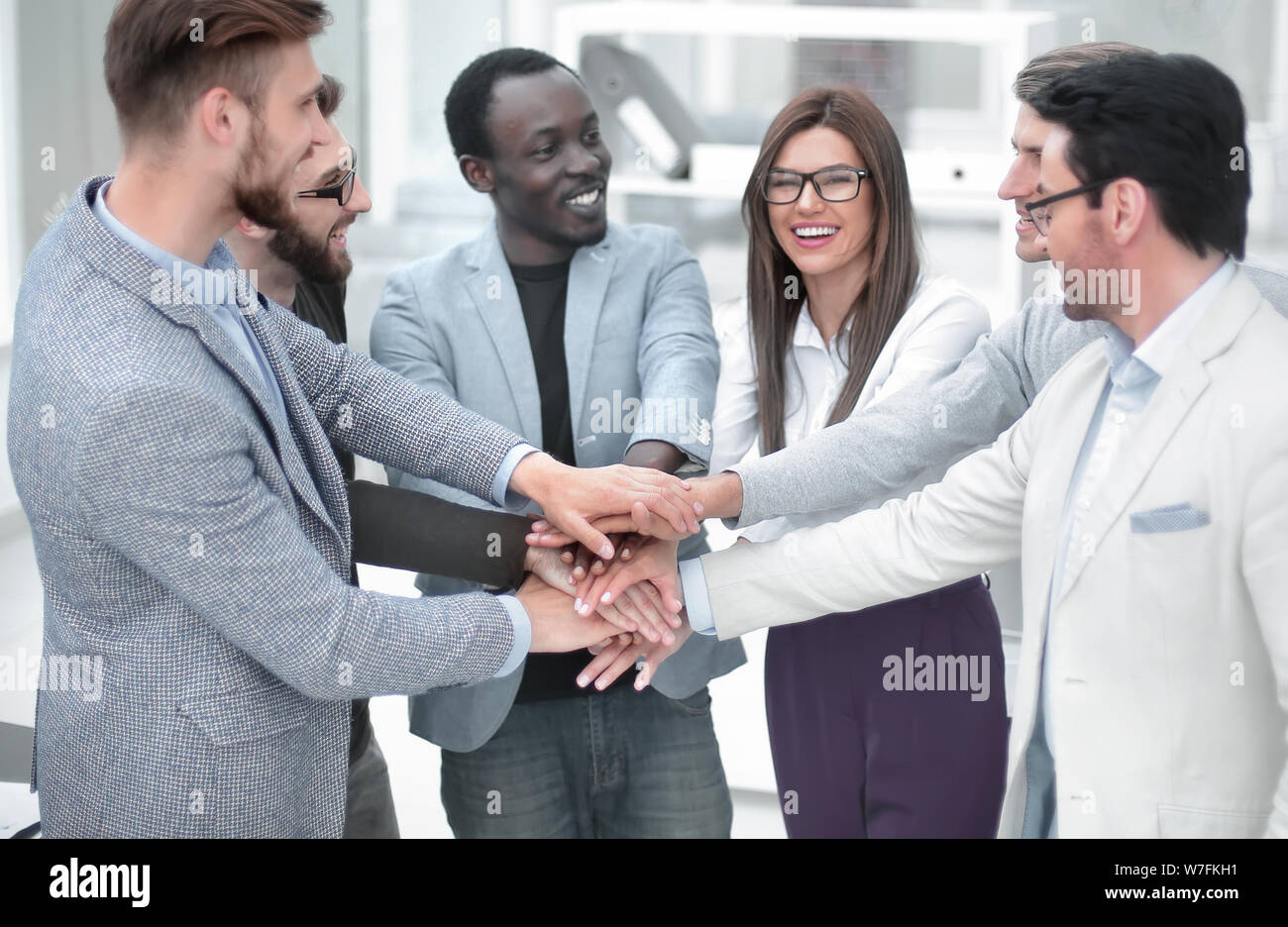 business team shows their unity Stock Photo - Alamy