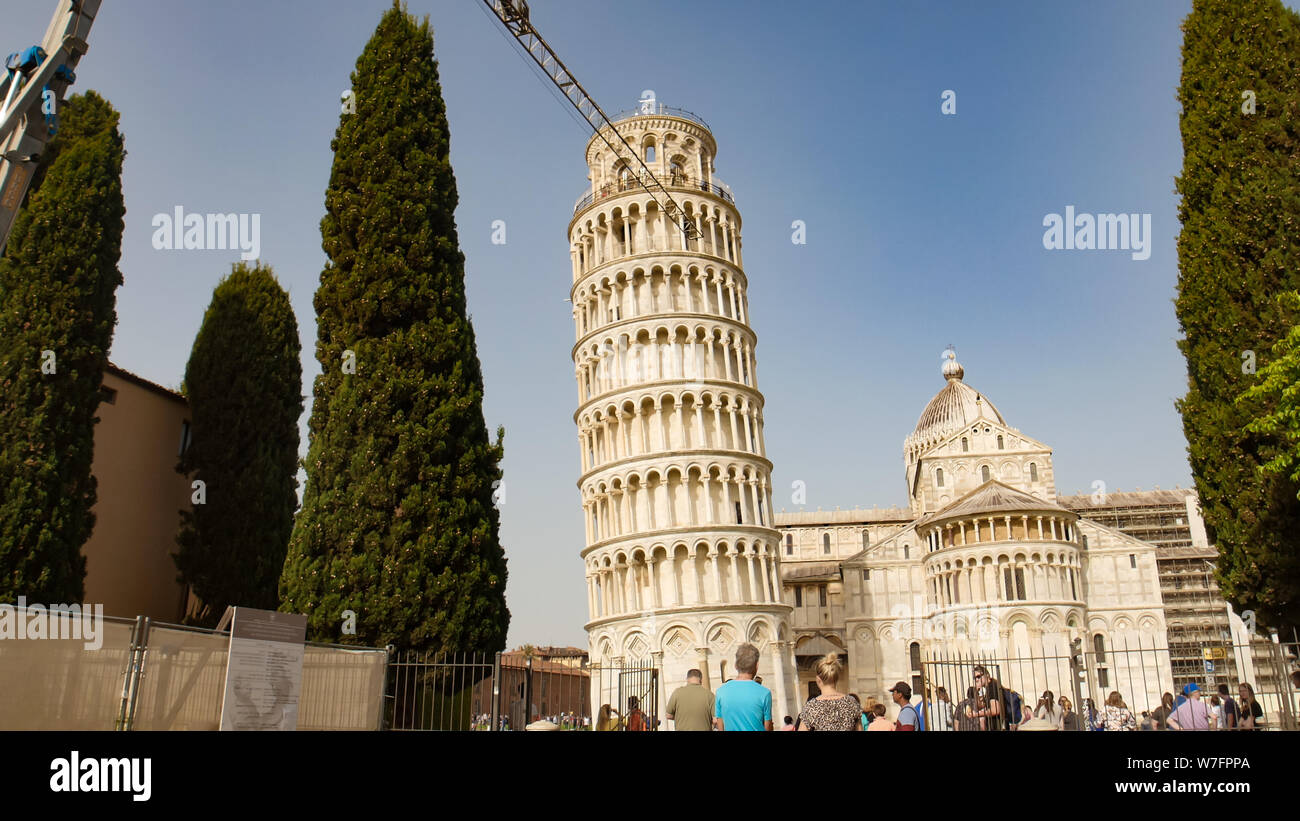 View of the leaning tower of Pisa under it a crowd of people - Wide ...