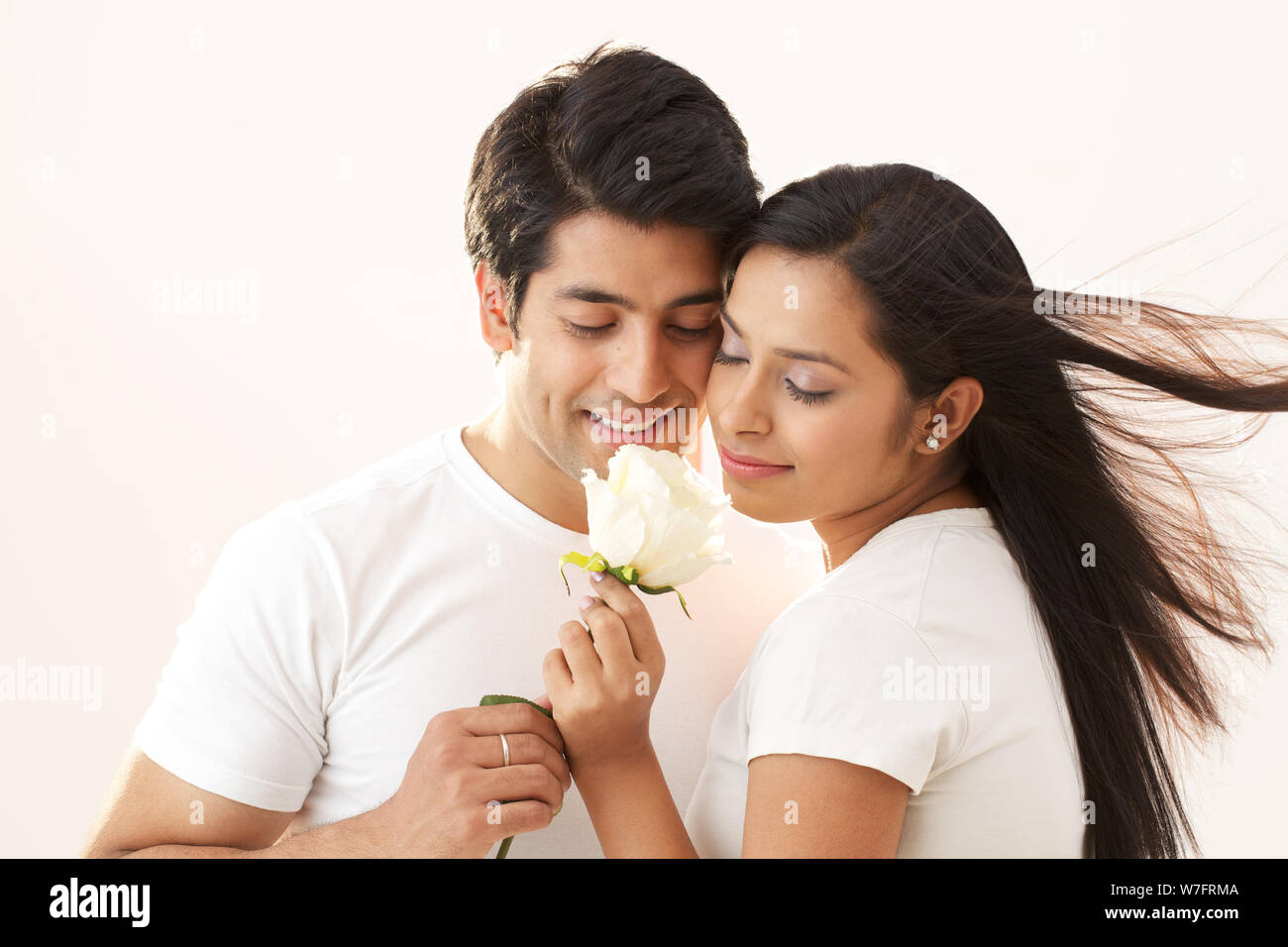 Smelling rose young hi-res stock photography and images - Alamy