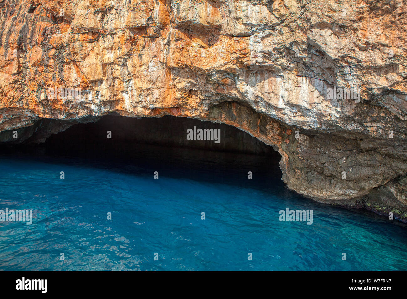 coastal cavern with blue sea water Stock Photo - Alamy