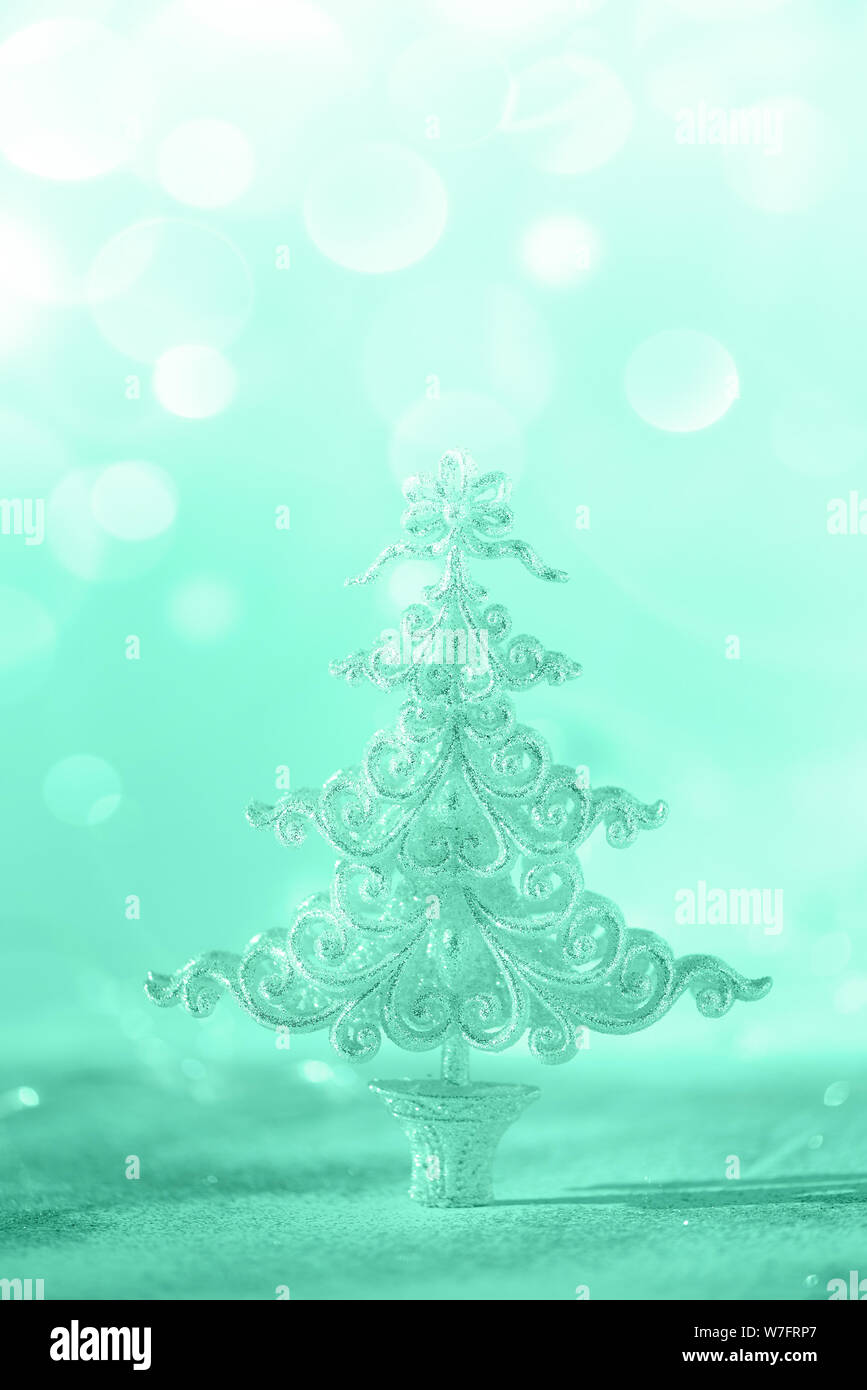 Silver glitter Christmas tree on neon blue background with lights bokeh ...