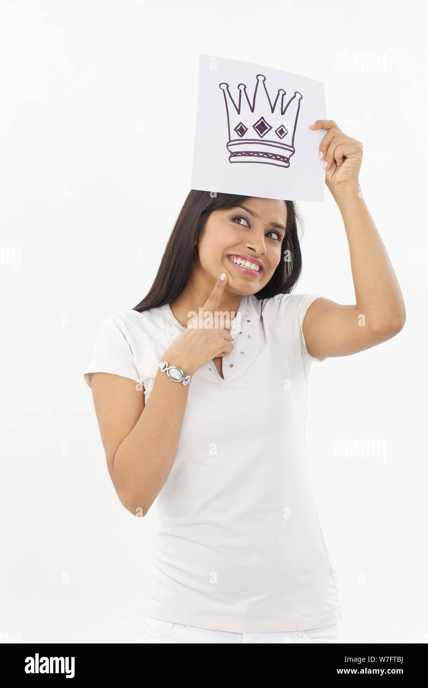 Young woman pretending to be a princess and thinking Stock Photo - Alamy