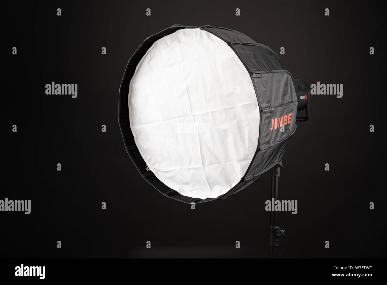 A modern electric saturated black octobox on a tripod. A huge octobox ...