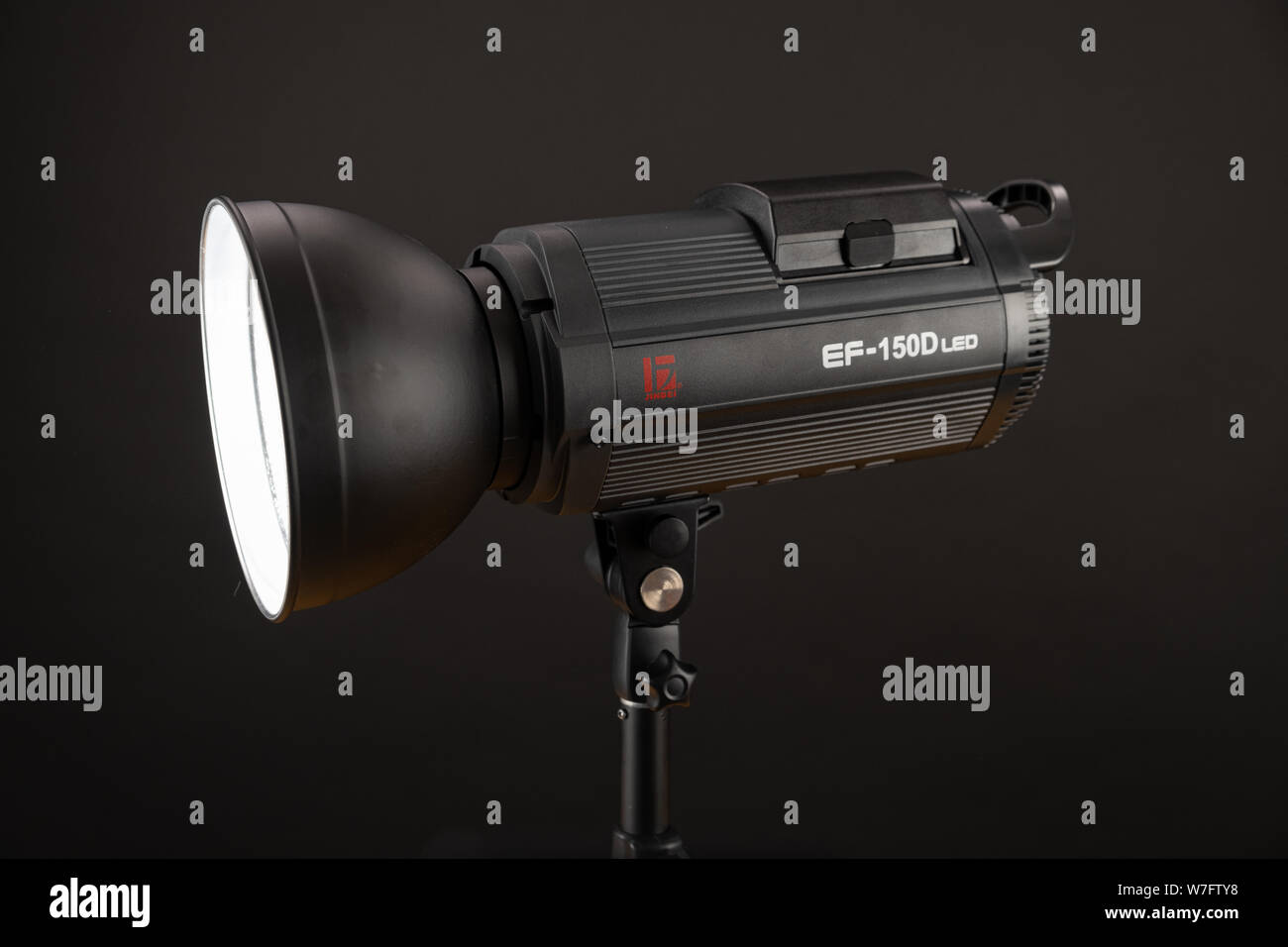 Studio flash lighting on black background. Jinbei profrssional flash ...