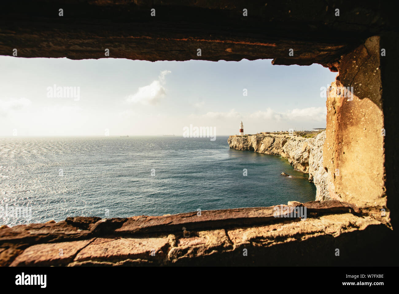 Stone window overlooking ocean beside cliff Stock Photo - Alamy