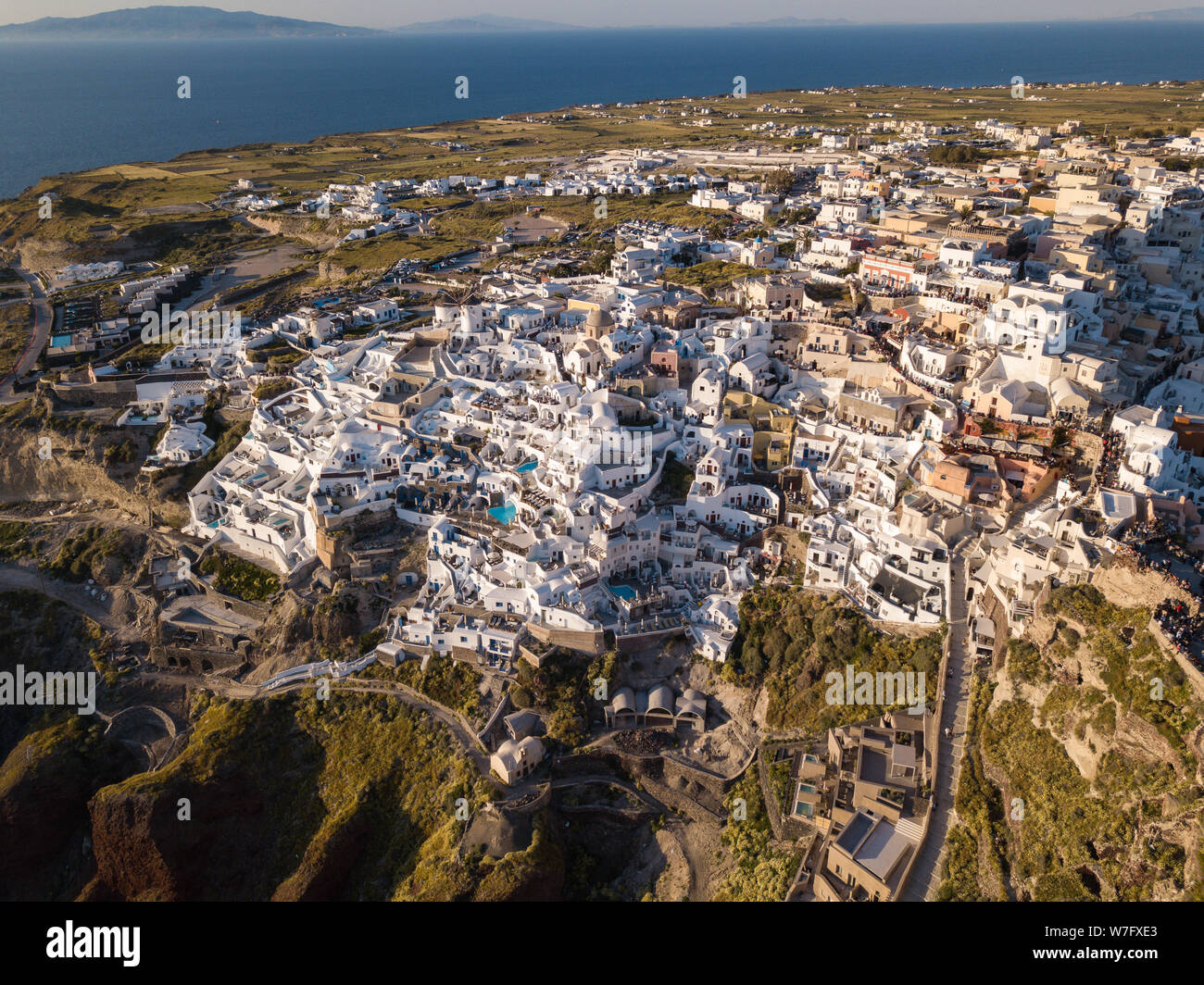 Aerial view of Santorini island, Greece, Oia village with windmills and ...