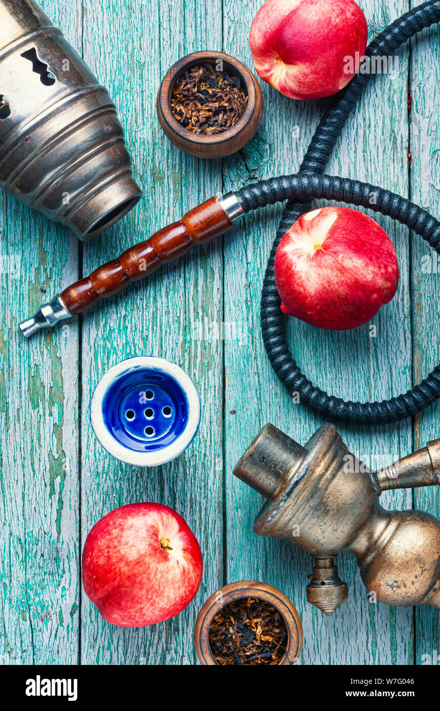 Tobacco shisha with nectarine flavor.Hookah with peach Stock Photo - Alamy