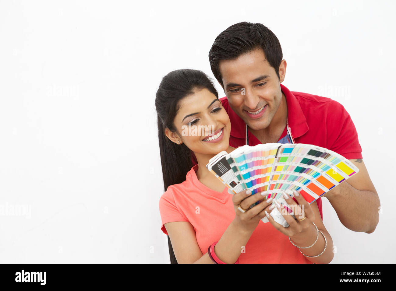 Young couple choosing colours from colour sample Stock Photo - Alamy