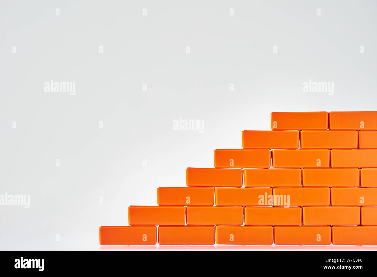 Wall made of toy bricks. Block stacking as step stair Stock Photo - Alamy