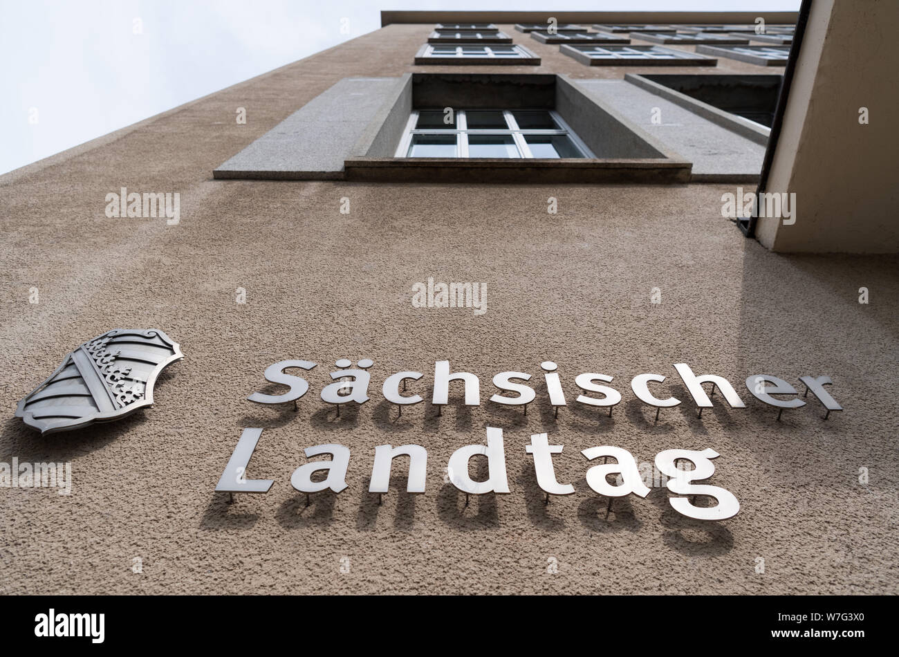05 August 2019, Saxony, Dresden: A Saxon coat of arms and the lettering ...