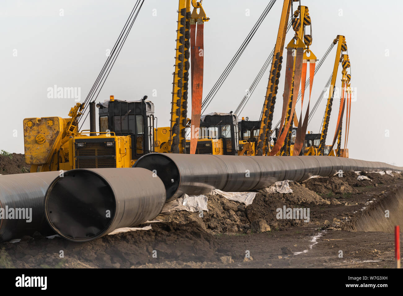 Construction of a new oil pipeline.Machine to twist pipes(pipelaying ...