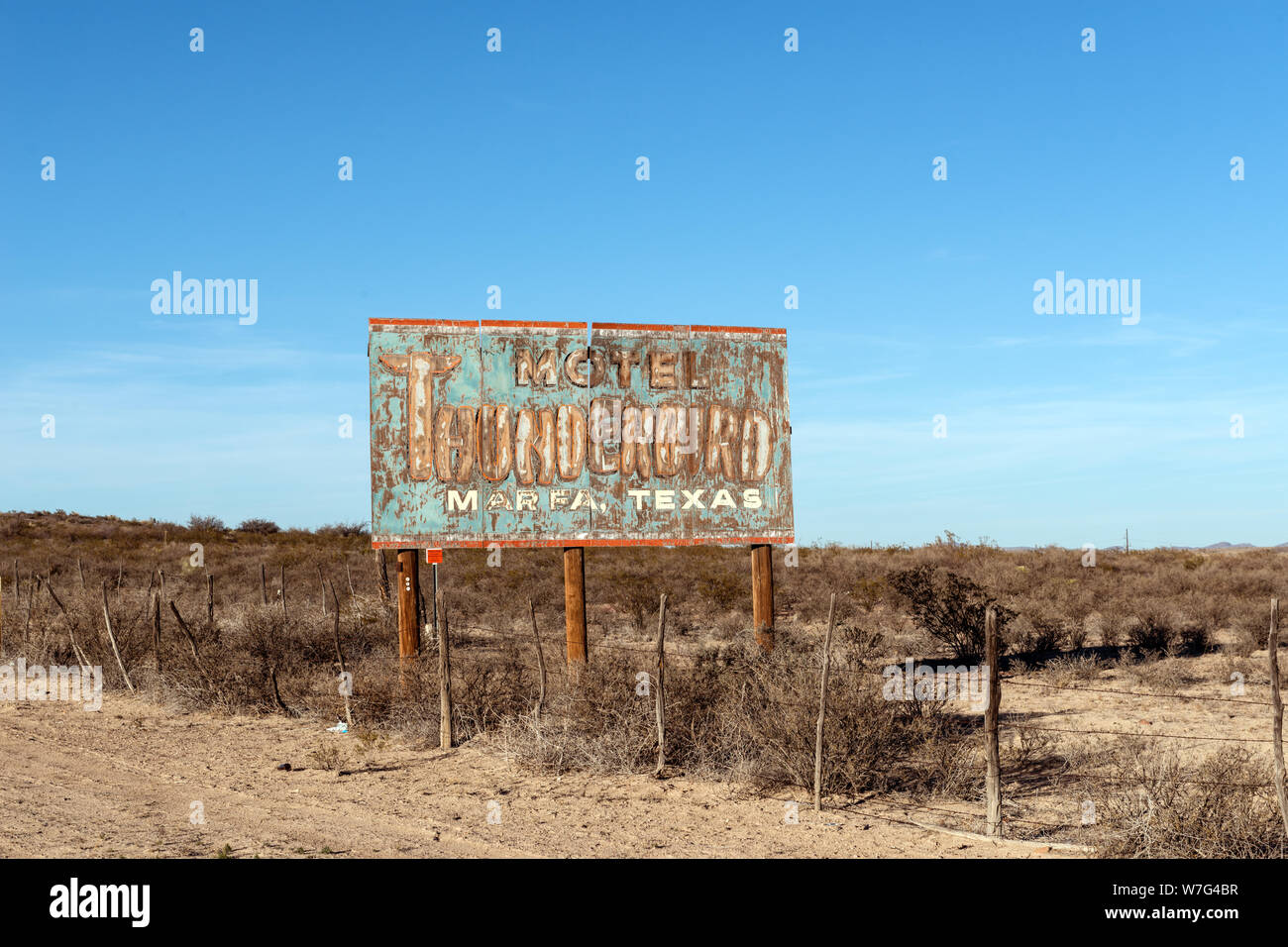 An old billboard in remote Presidio County, Texas, for the Motel Thunderbird, up ahead in the ...