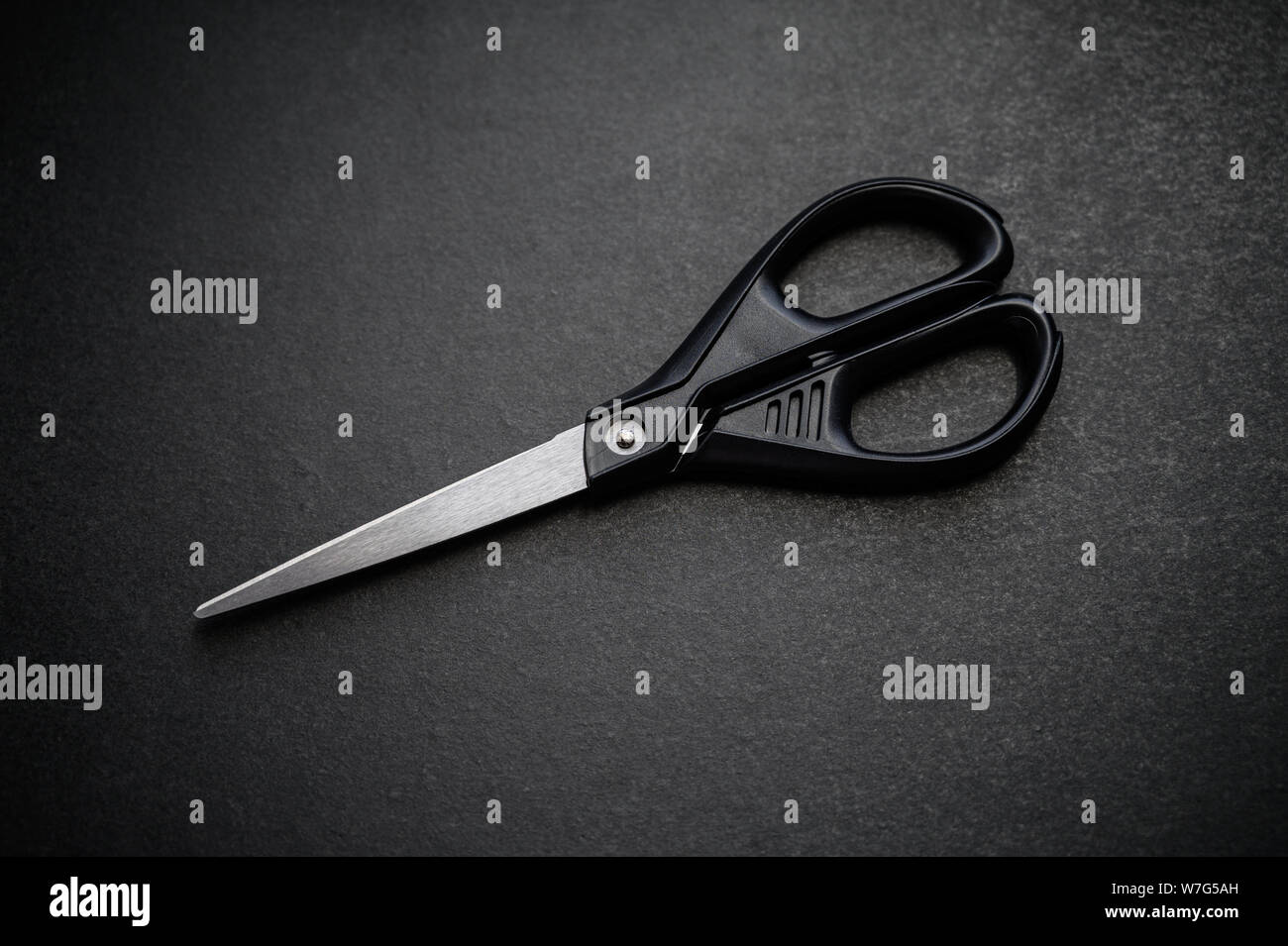 Scissors on a black background Stock Photo - Alamy