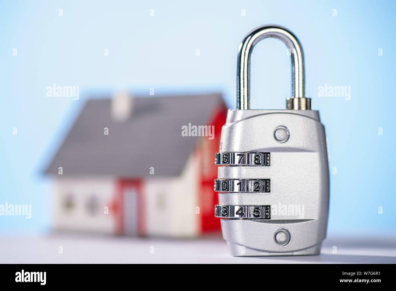 Combination lock with house in the background | usage worldwide Stock ...