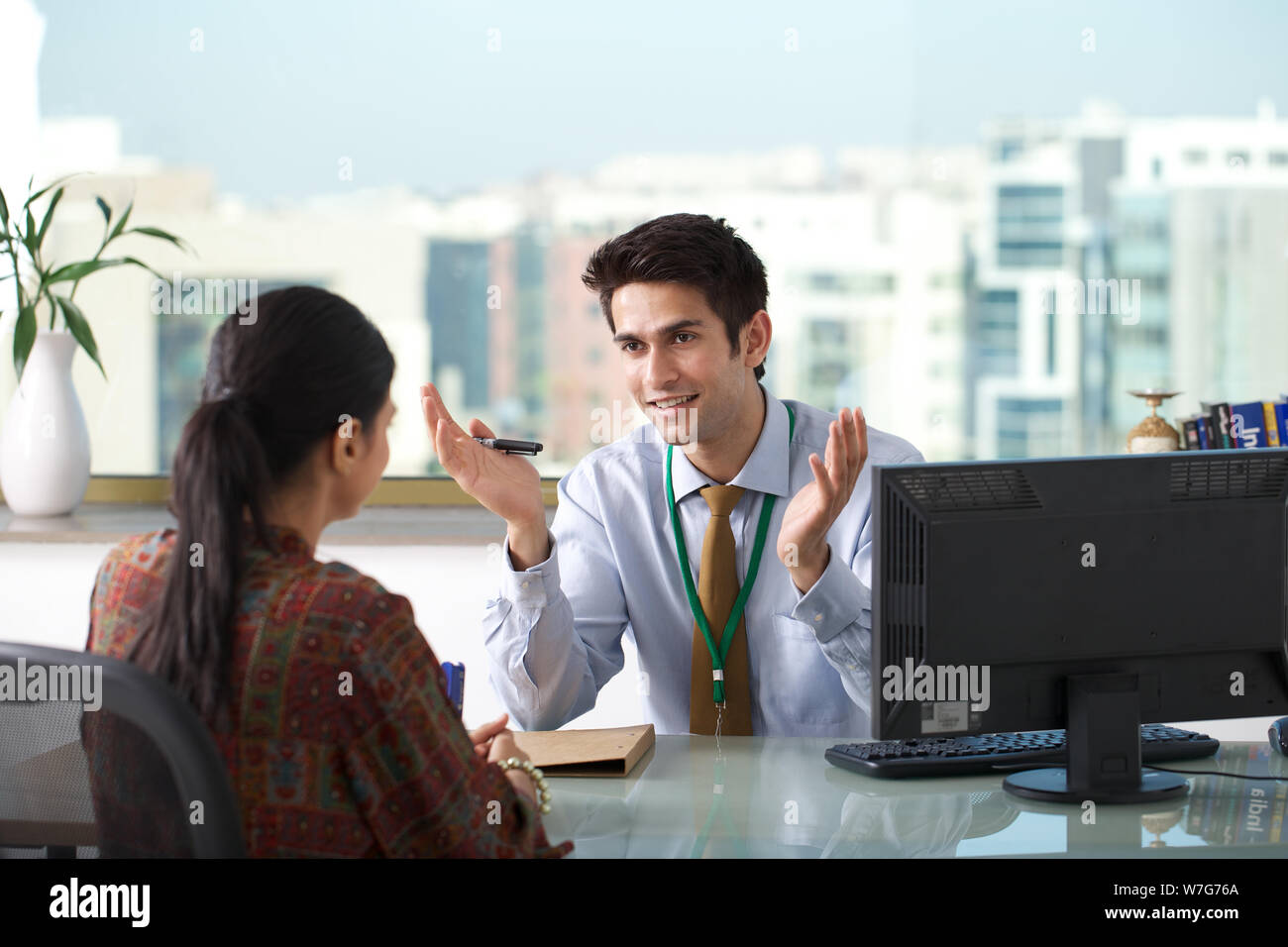 Financial advisor explaining with his customer in office Stock Photo ...