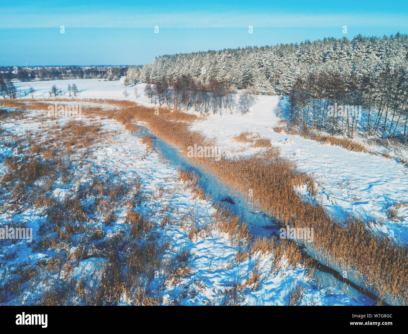 Aerial view of the frozen brook at the edge of the forest Stock Photo ...