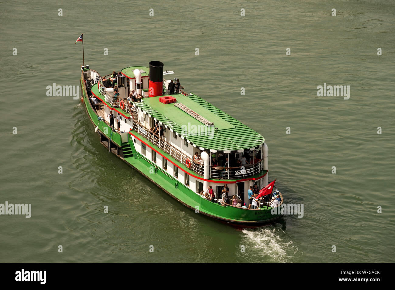 Basler Dybli, a boat for tourists on the river Rhine in Basel ...