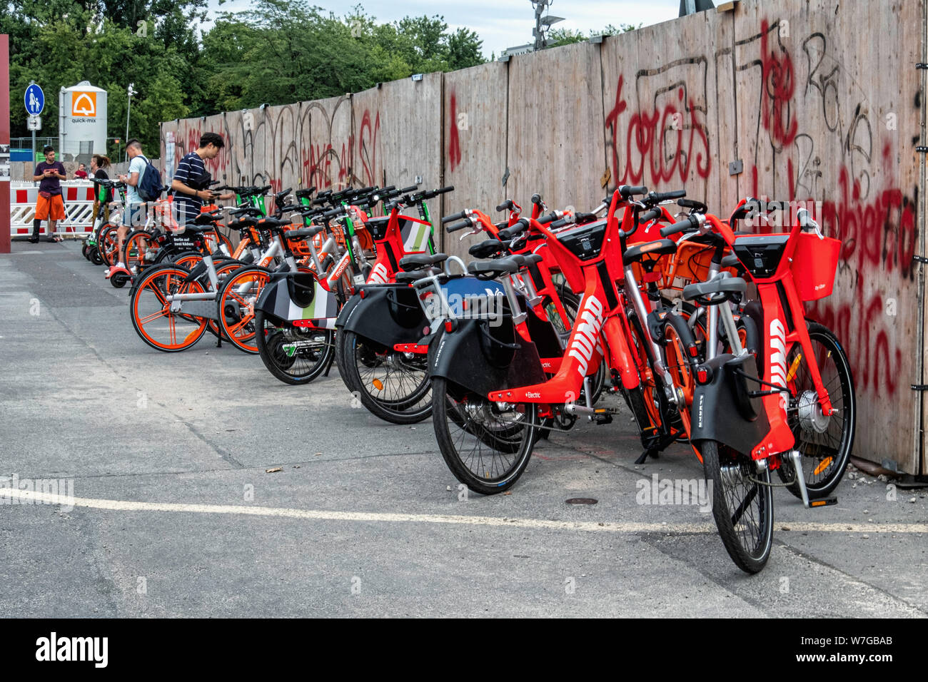 Electric two wheelers. E-scooters and battery-powered bikes clutter the ...