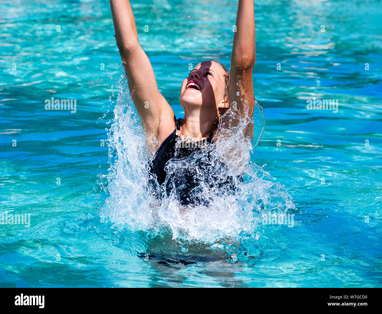 Splashing in the swimming pool hi-res stock photography and images - Alamy