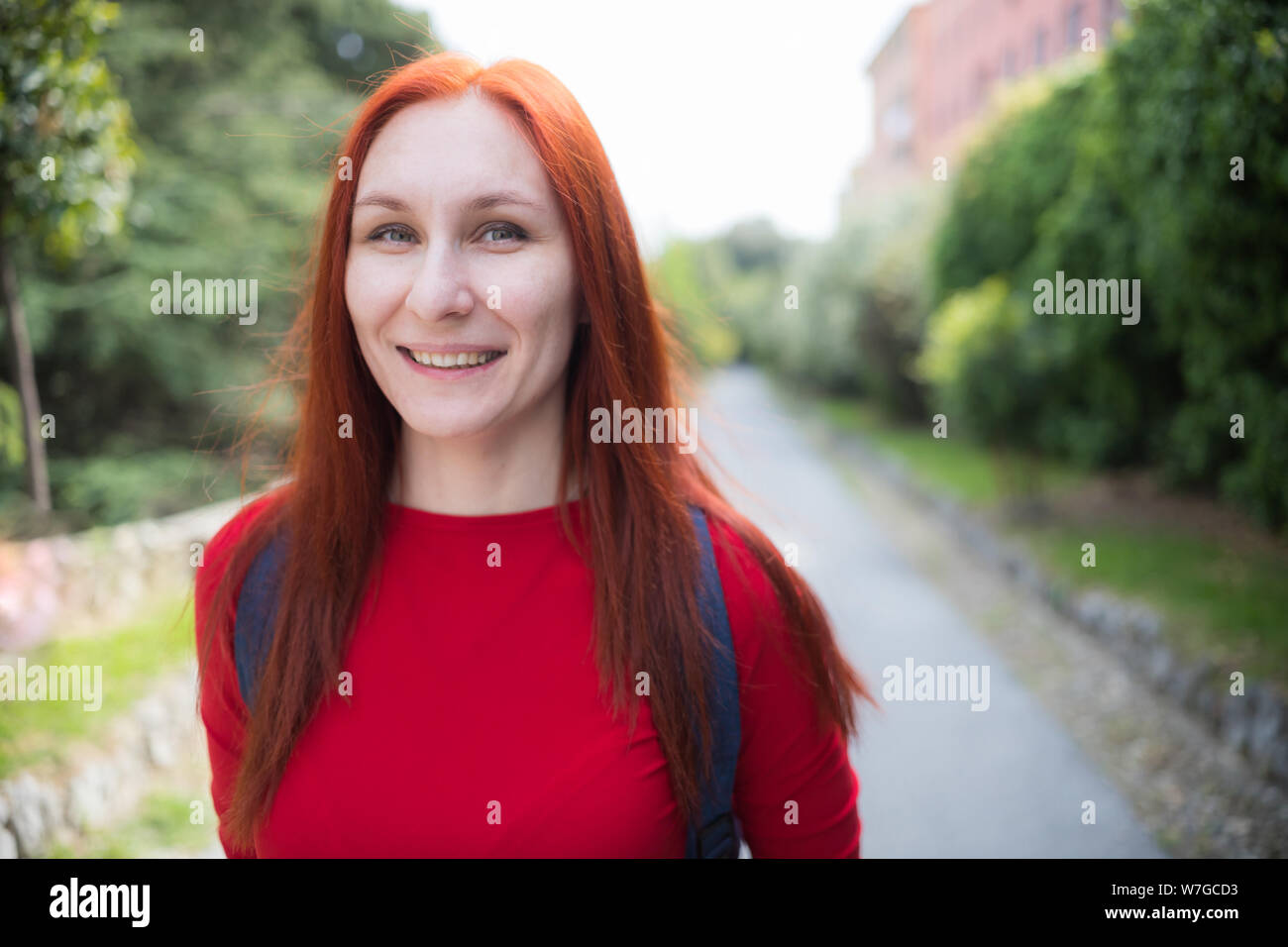 A portrait of adult ginger woman walking outside Stock Photo - Alamy