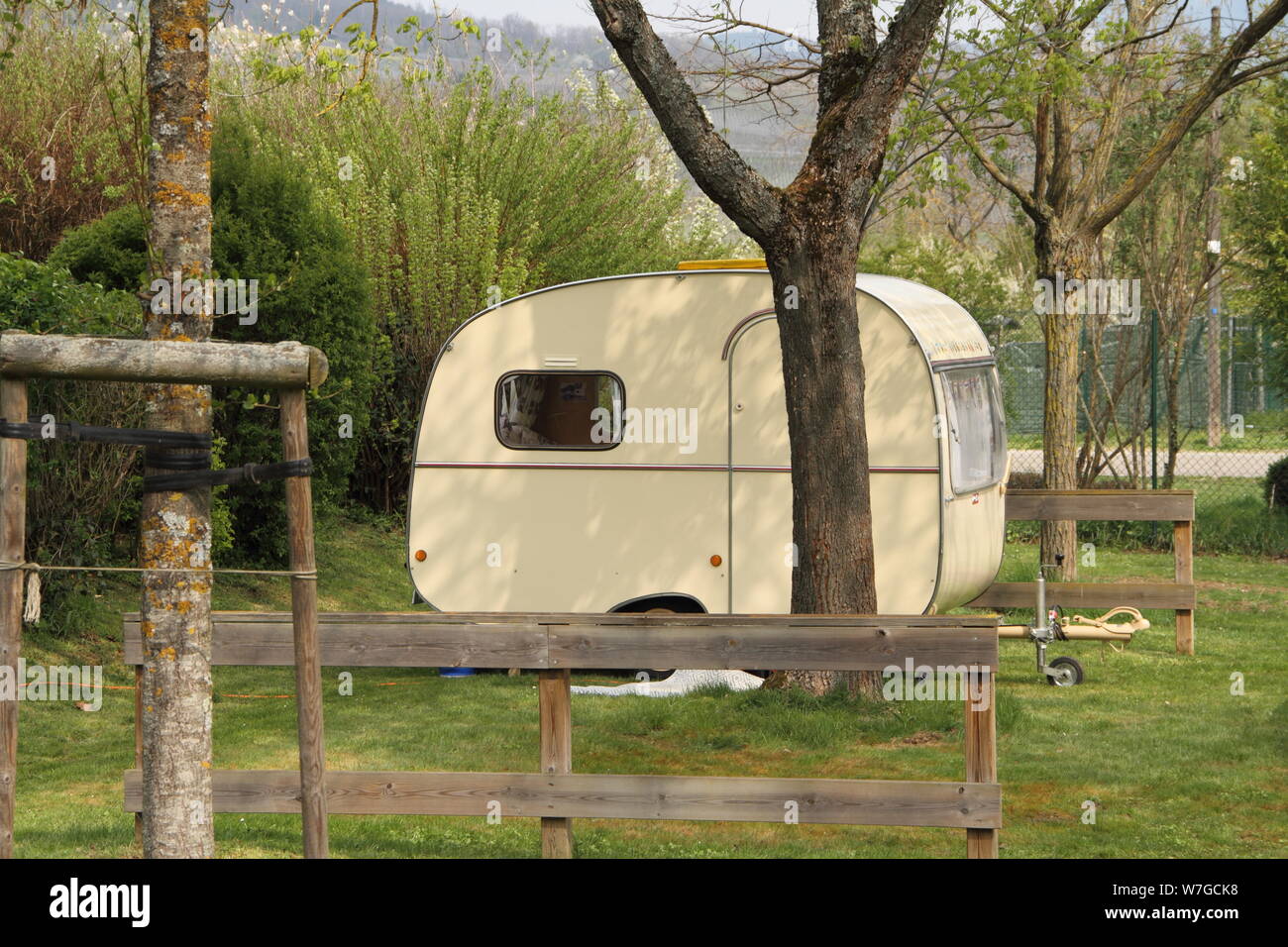 An old little caravan in the woods Stock Photo - Alamy