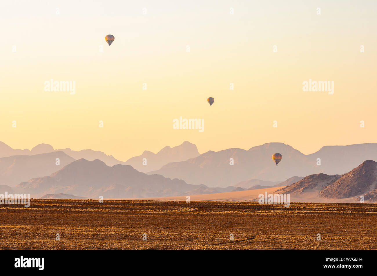 Three hot-air balloons flying over Sossusvlei, Namib-Naukluft National ...