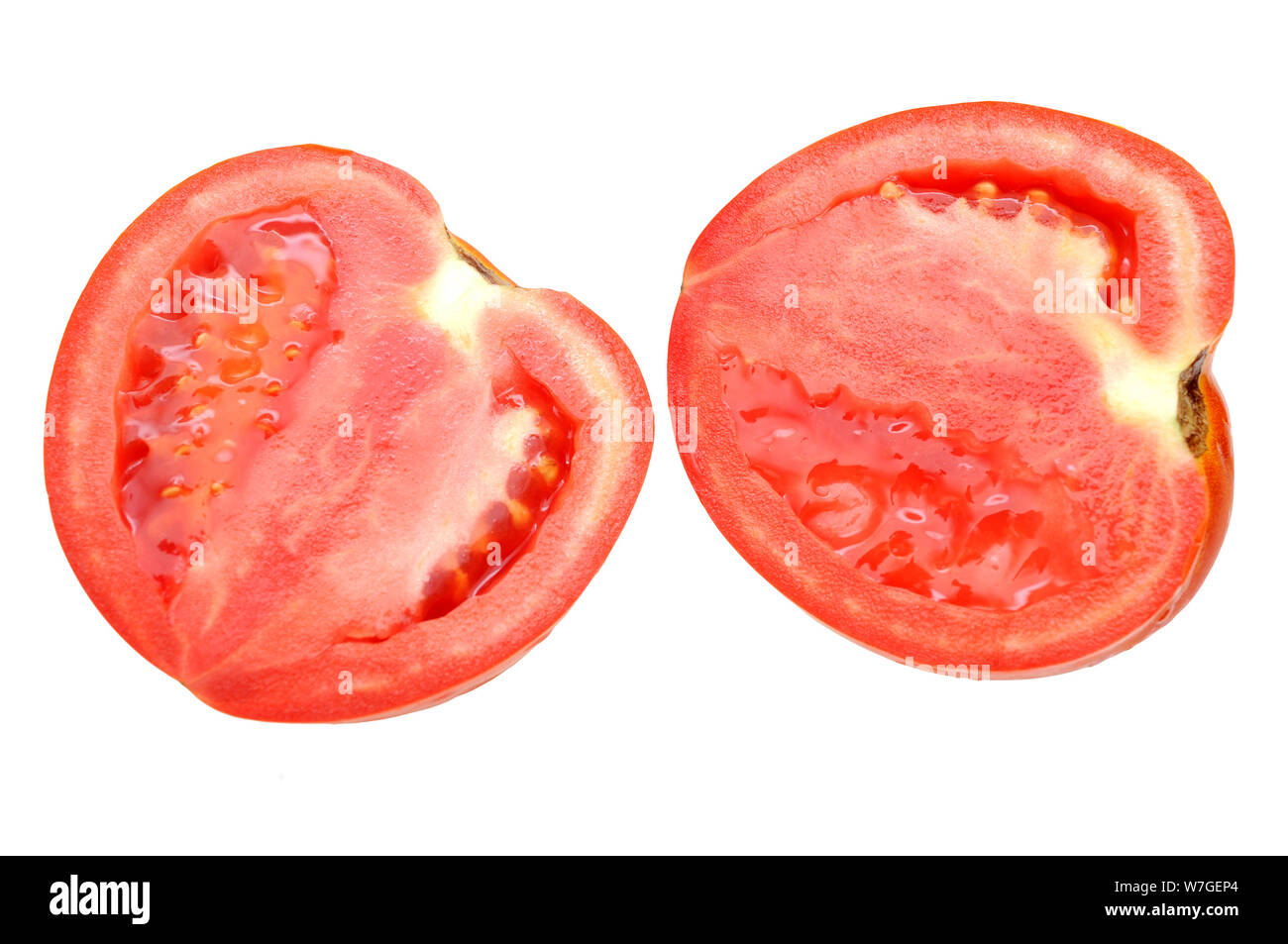 cut haft tomato isolated on white Stock Photo - Alamy