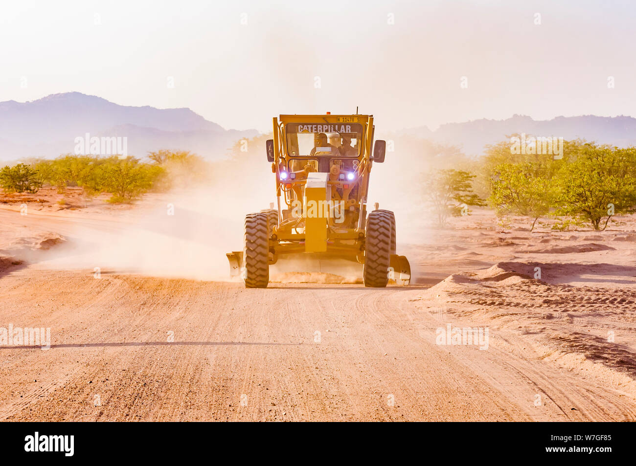 Road grader smoothing a dirt road in Namibia Stock Photo - Alamy