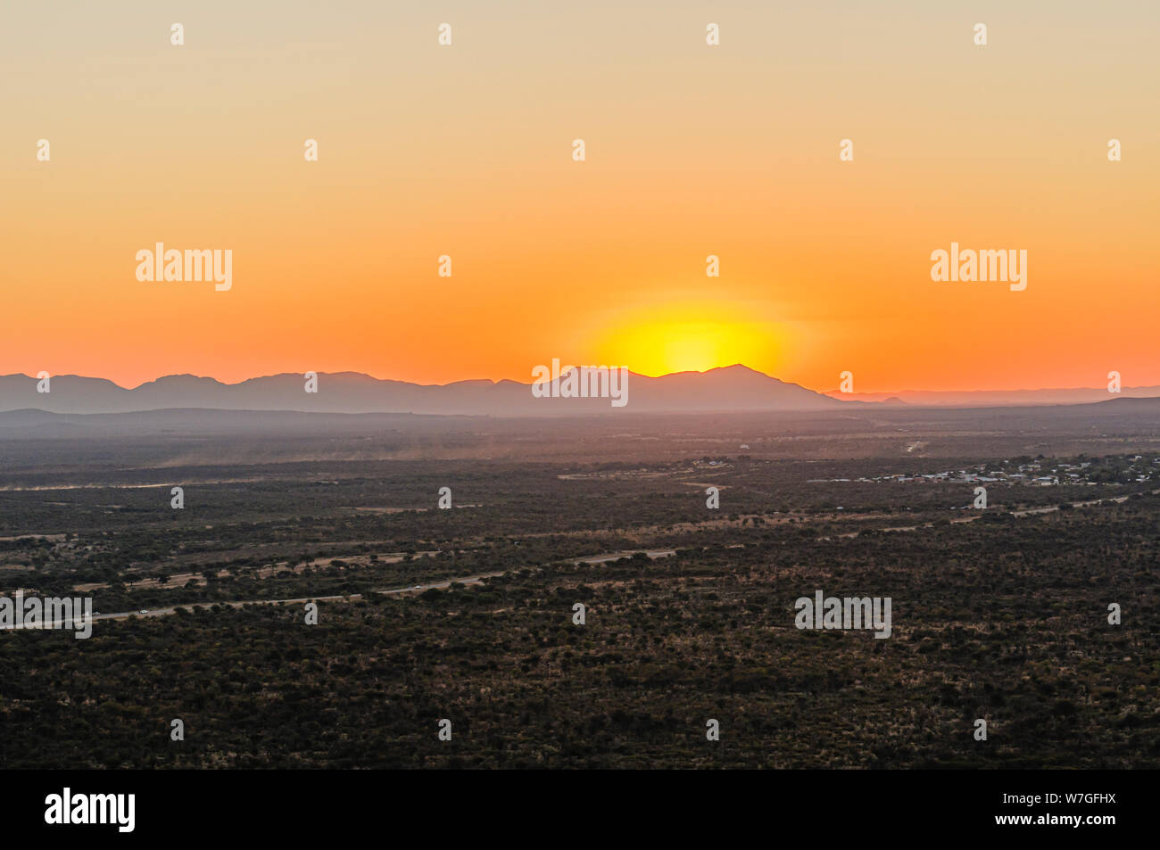 African sunset behind mountains from Otjiwarongo, Namibia Stock Photo ...