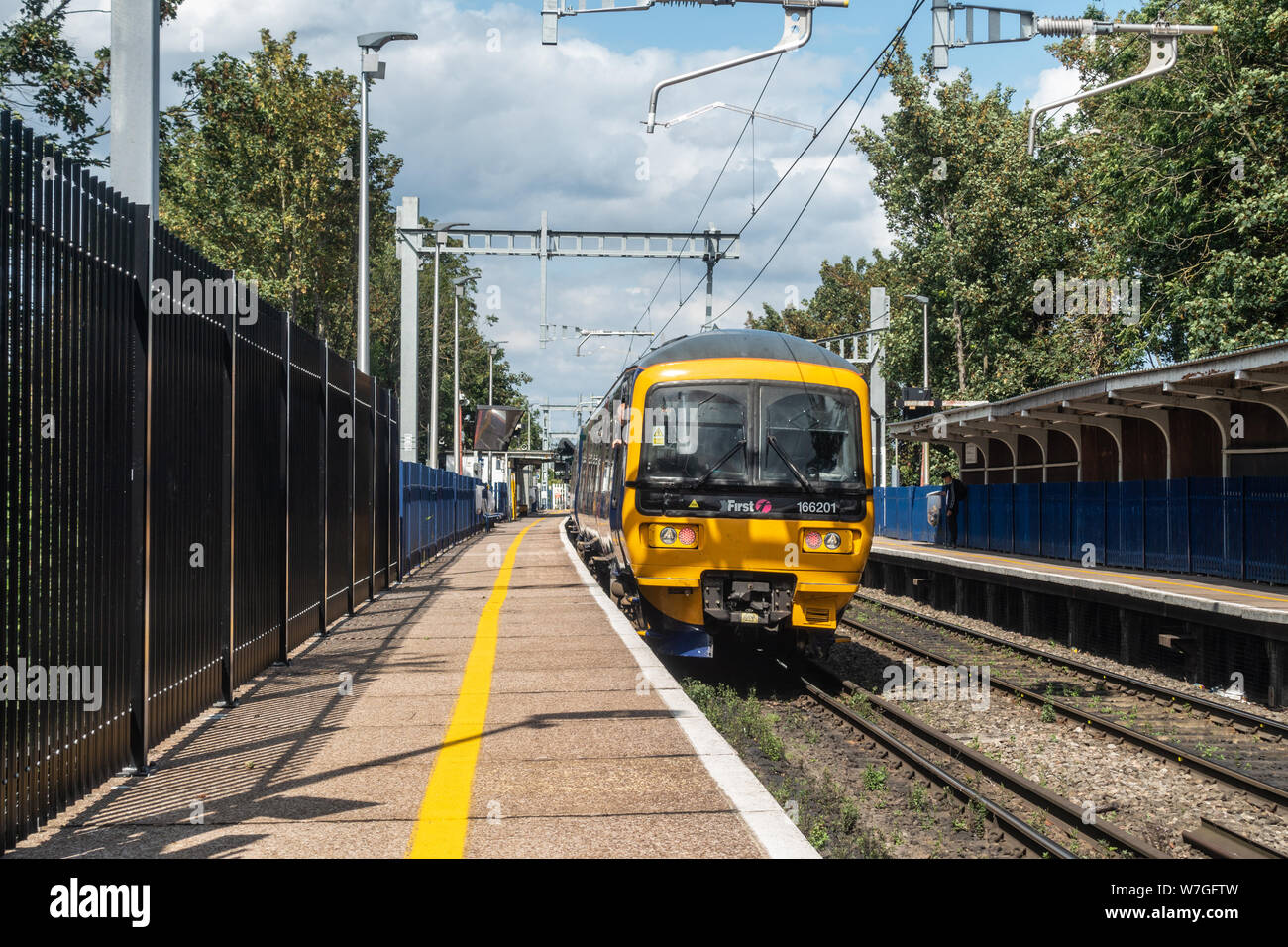 A local trains sits and waits at the platform at west Reading Railway ...