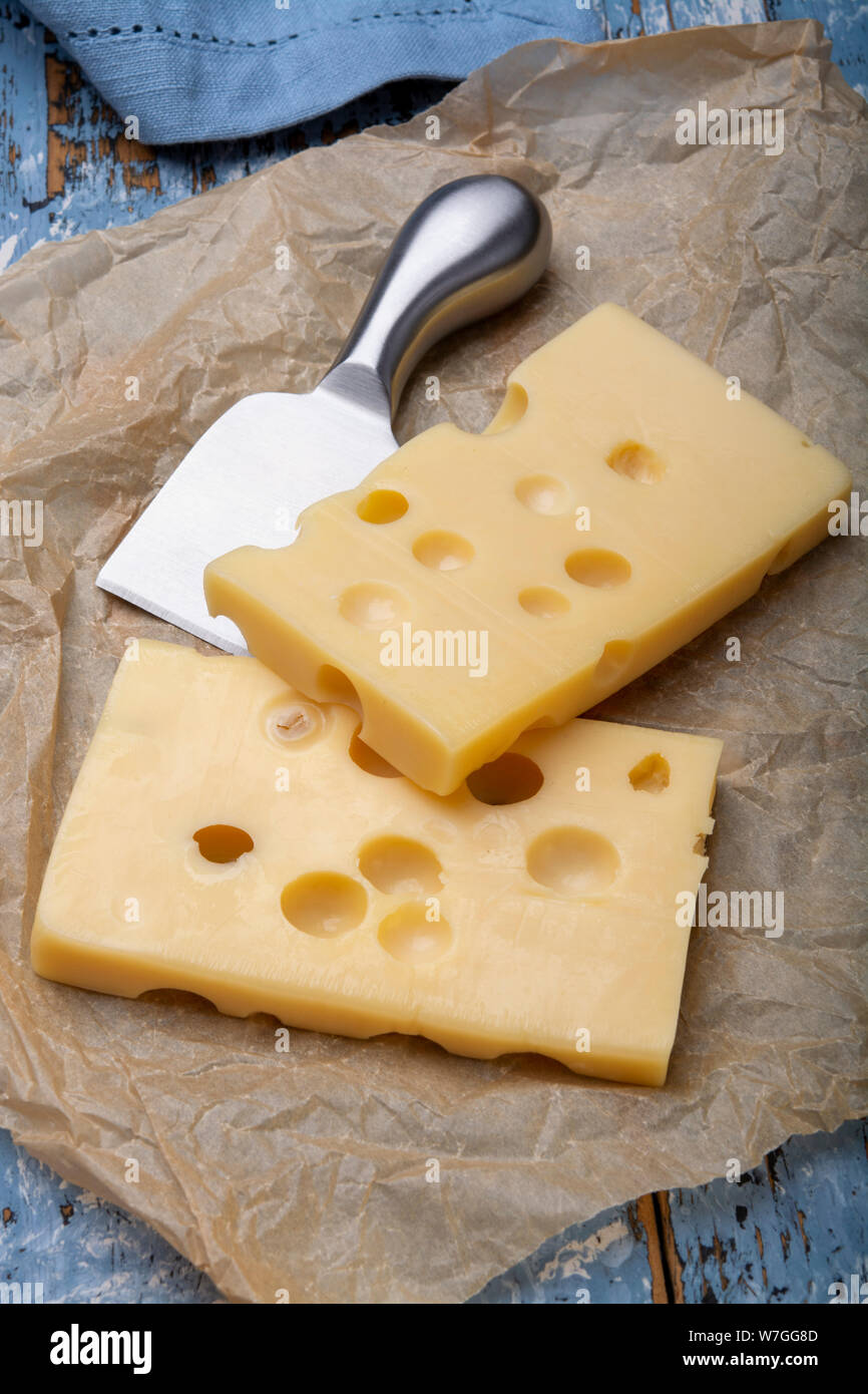 Two blocks of French emmental semi-hard cheese close up Stock Photo - Alamy