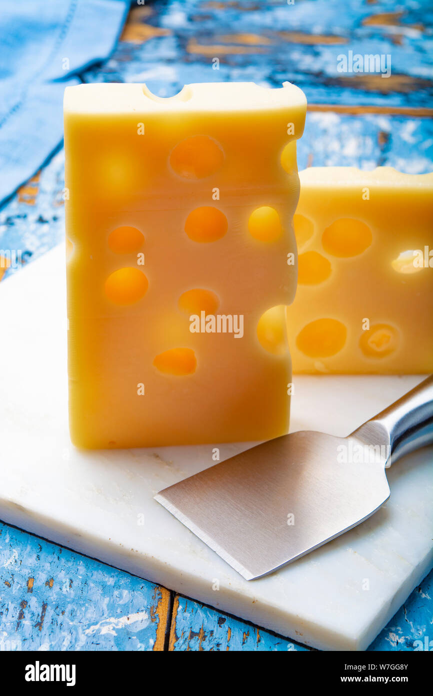 Two blocks of French emmental semi-hard cheese close up Stock Photo - Alamy