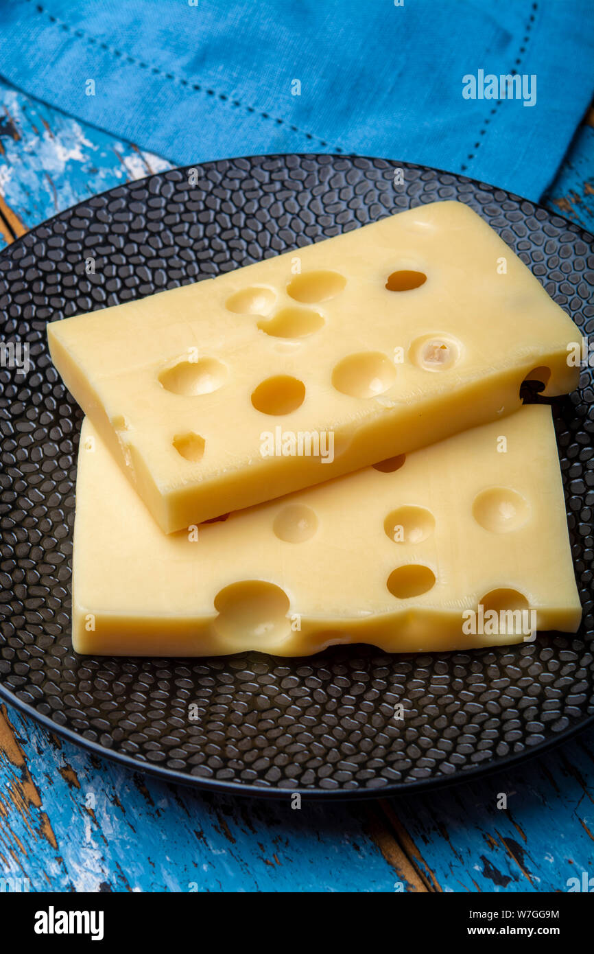 Two blocks of French emmental semi-hard cheese close up Stock Photo - Alamy