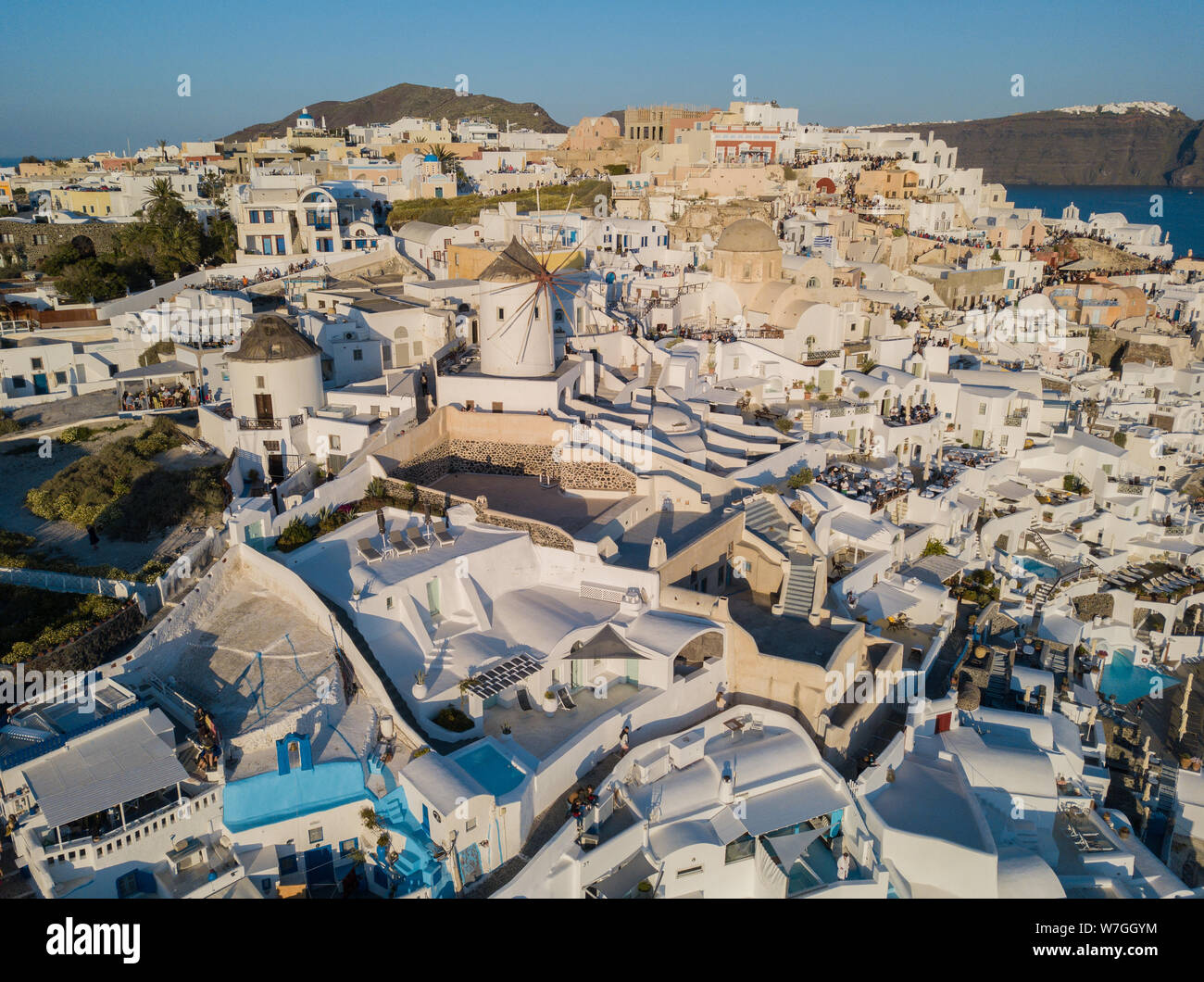 Aerial view of Santorini island, Greece, Oia village with windmills and ...