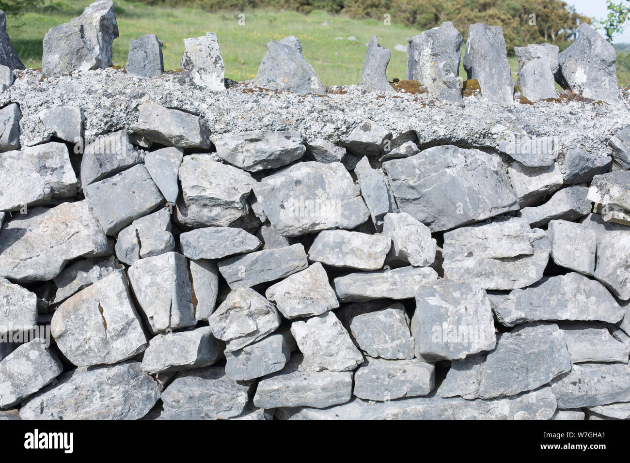 Stones piled on top of each other to create a fence Stock Photo - Alamy