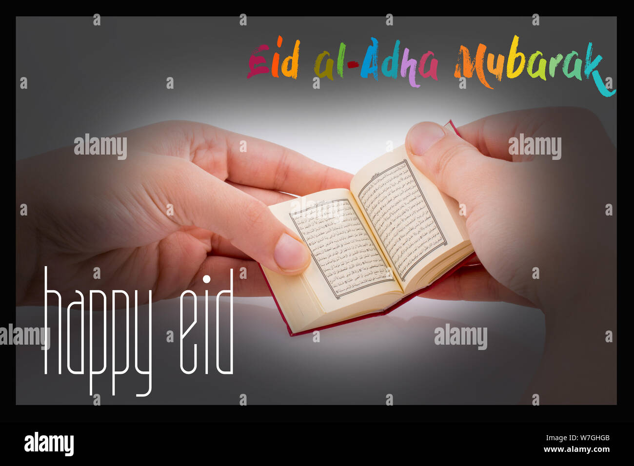 Hand holding The Holy Quran on a white background Stock Photo - Alamy